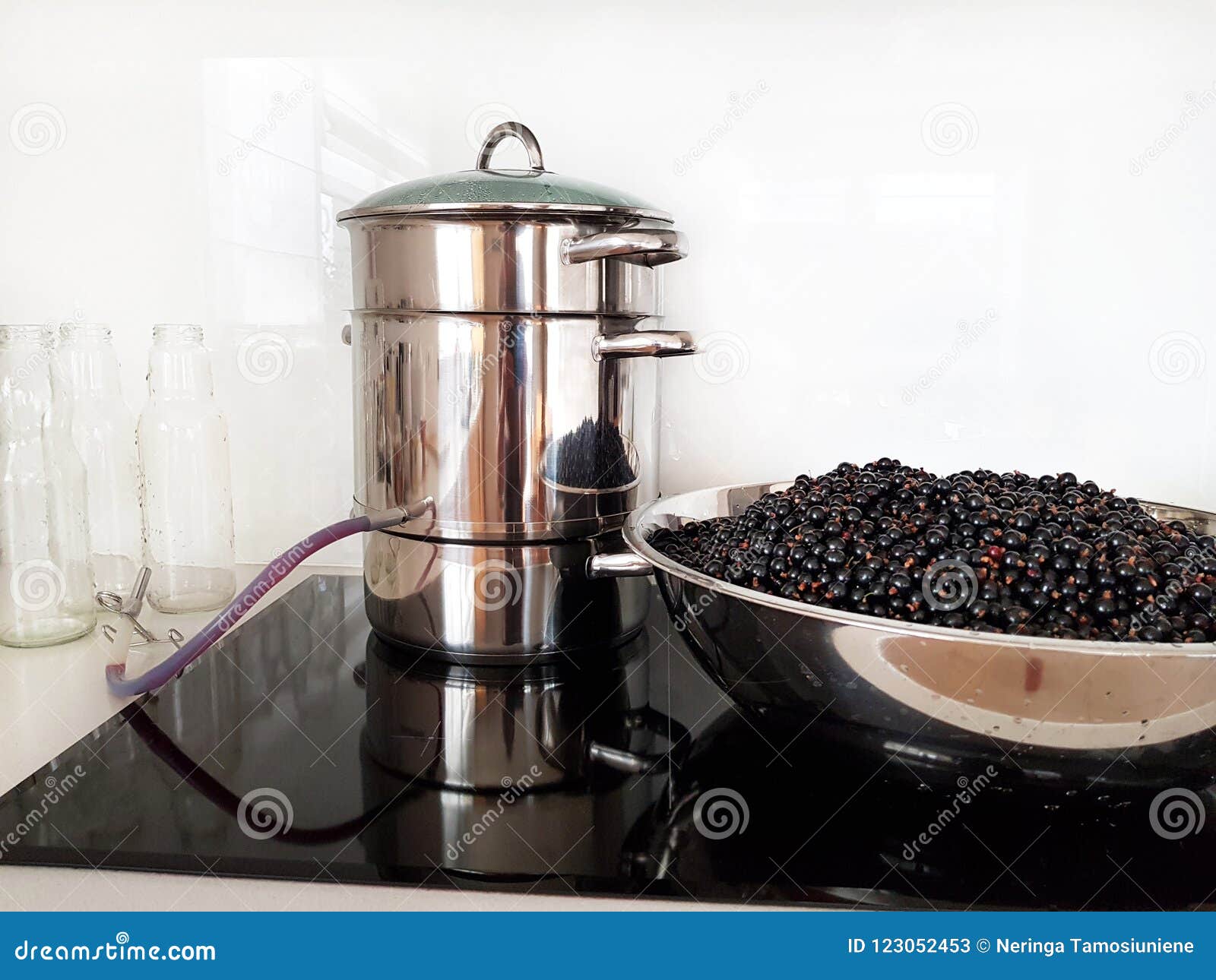 Black Currant Juice Making by Steam Juicer Pot in the Kitchen Stock ...