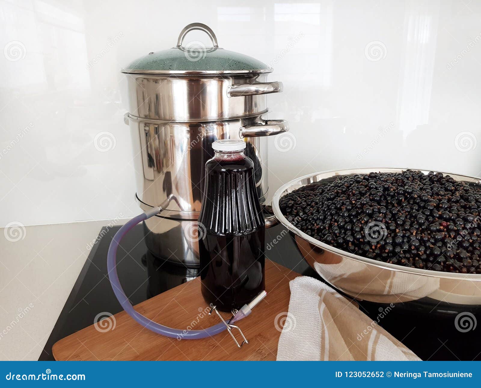 Black Currant Juice Making by Steam Juicer Pot in the Kitchen Stock ...