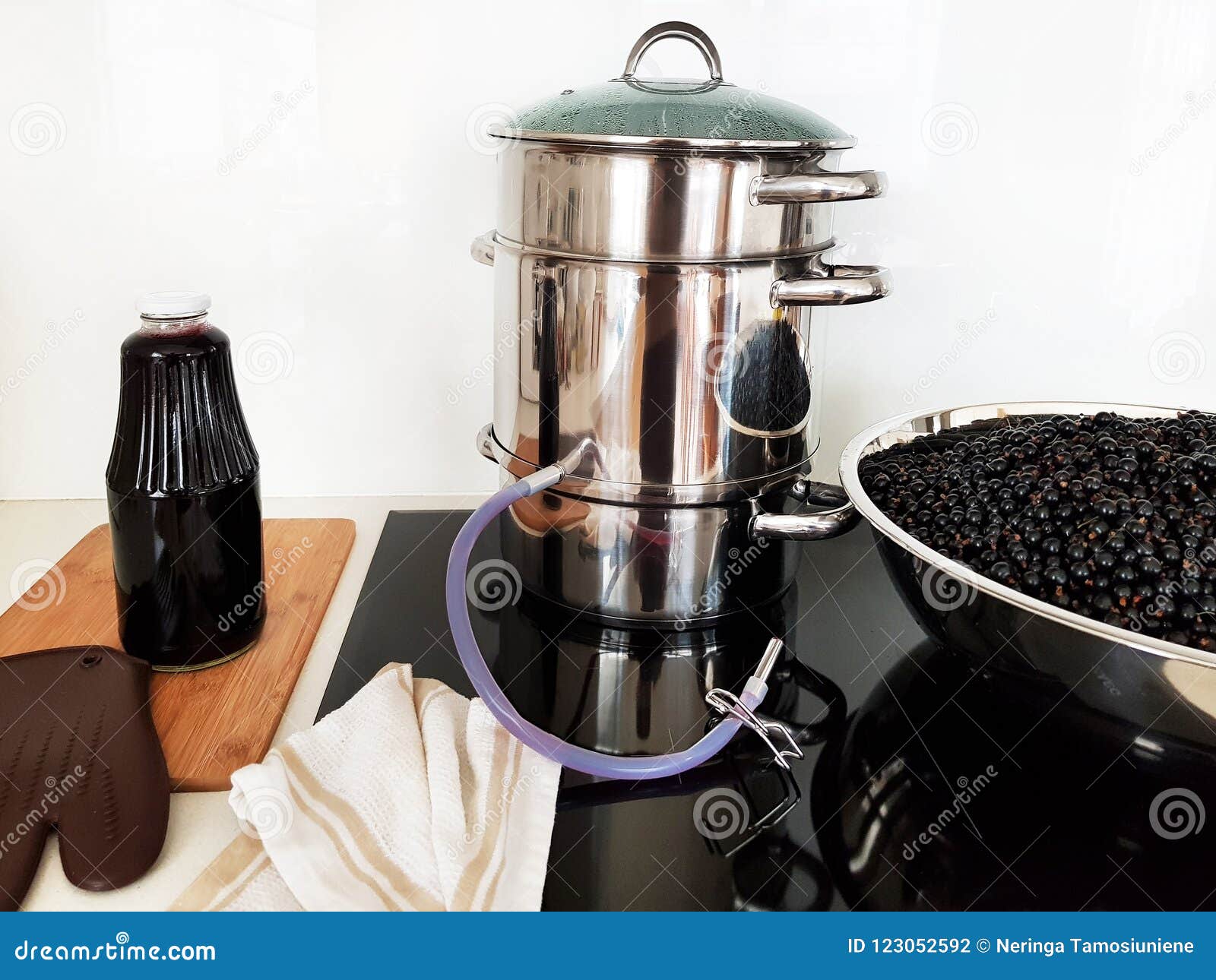 Black Currant Juice Making by Steam Juicer Pot in the Kitchen Stock ...