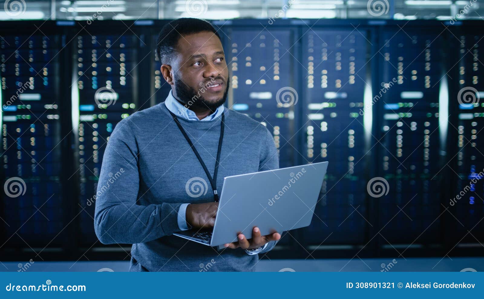 Black Data Center it Technician Standing in the Middle of a Server Rack ...