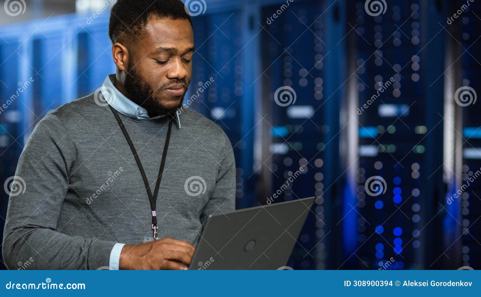 Black Data Center it Technician Standing in Server Rack Corridor with a ...