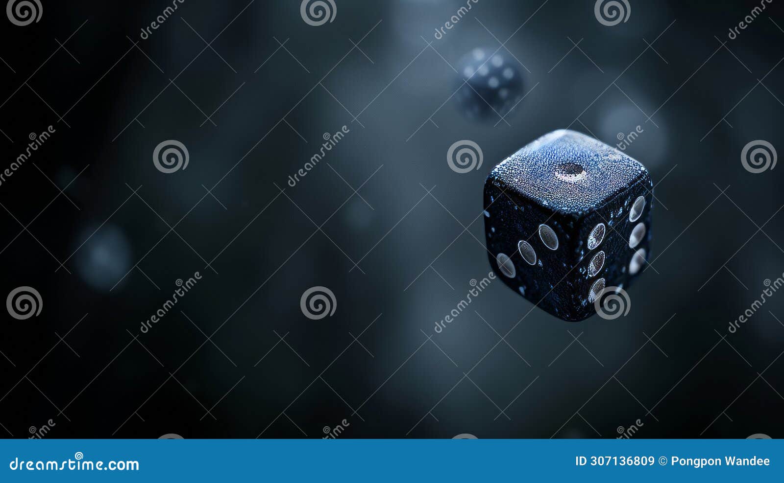 A Black Dice Floating in the Air with White Dots and a Dark, Blurred ...