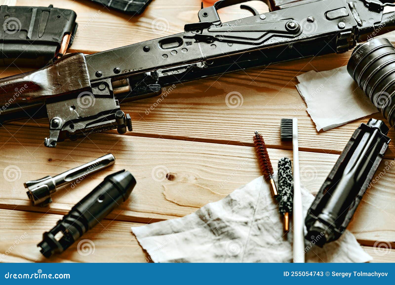 Black Disassembled Shotgun and Cleaning Tools on Wooden Table . Stock ...