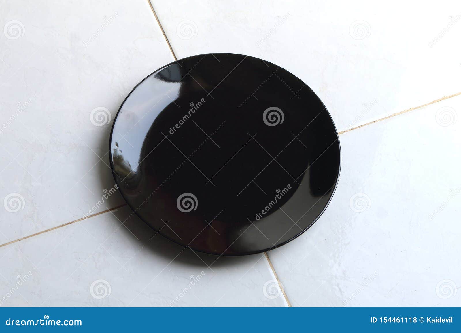Black dish on the floor stock photo. Image of dust, modern - 154461118