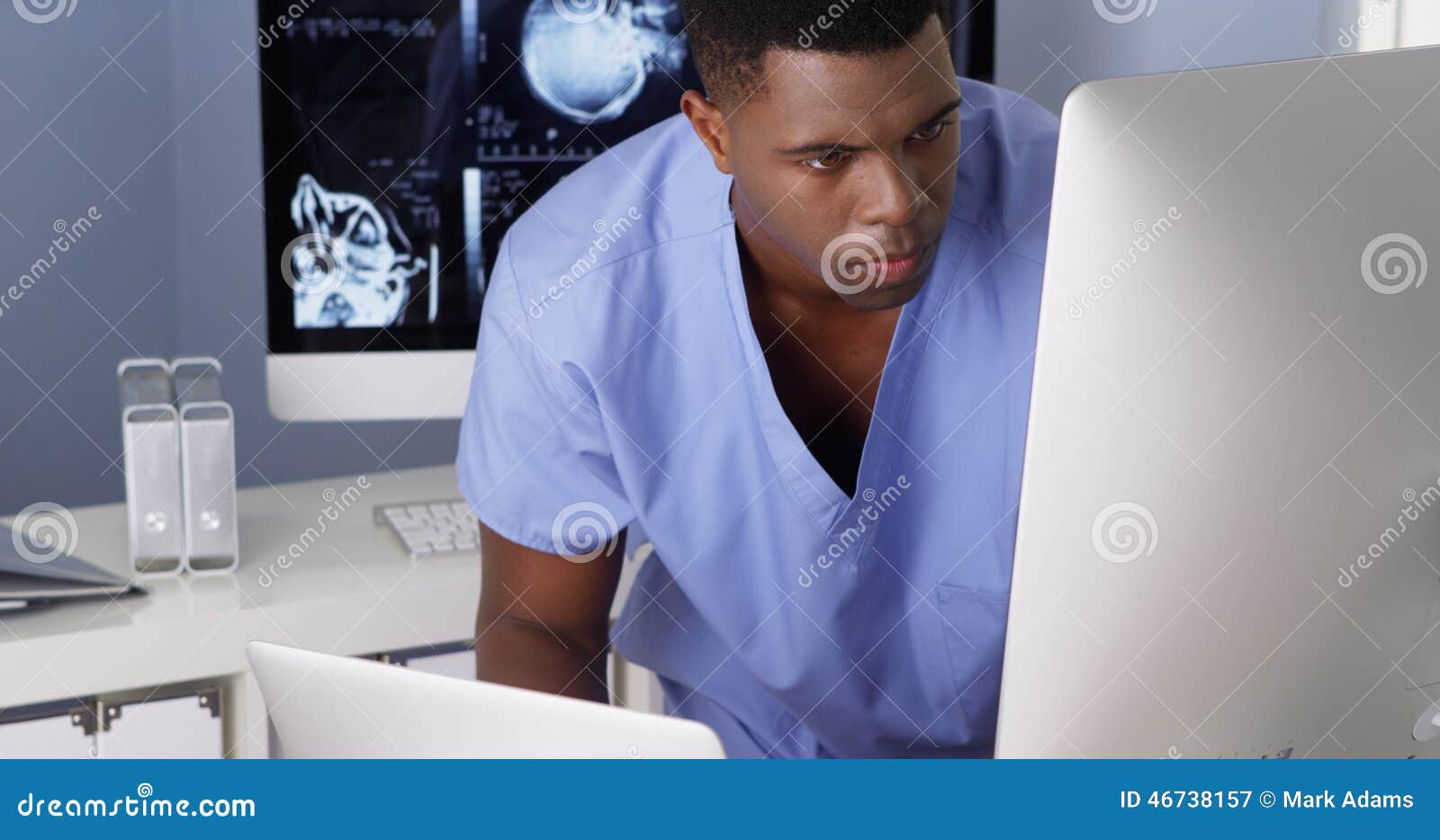 Black Doctor Working on Multiple Computers Stock Image - Image of ...