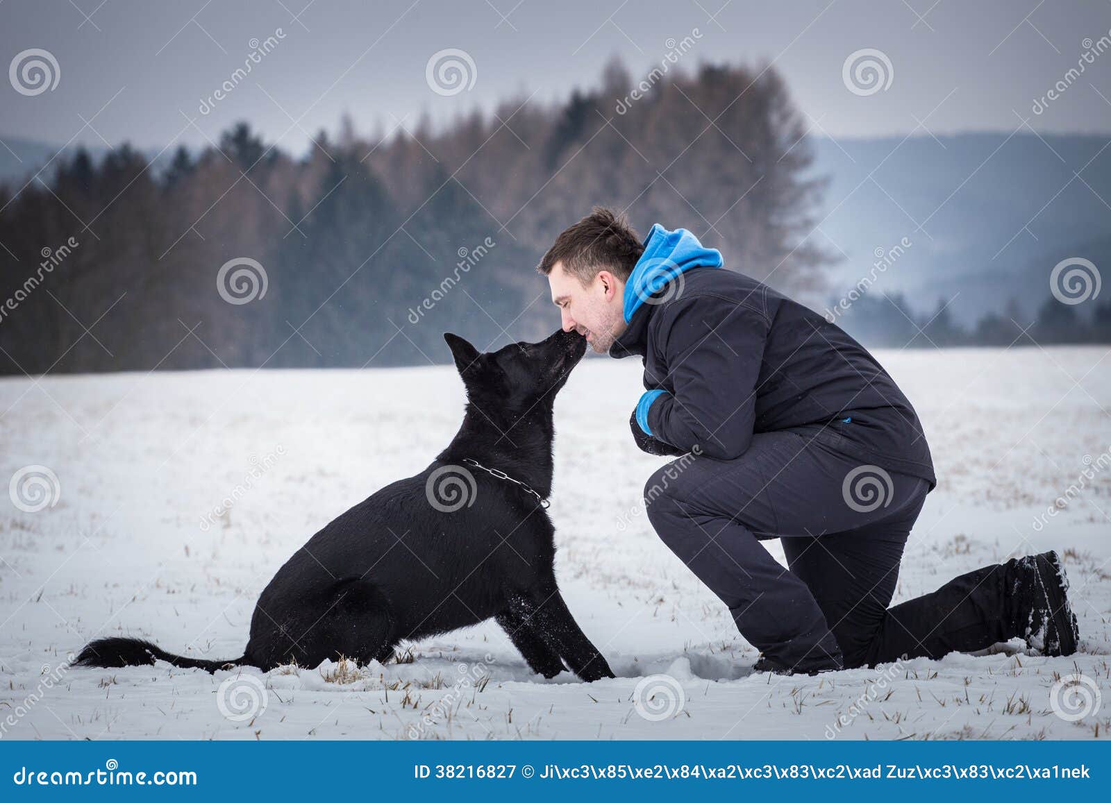 Black dog with his owner stock image. Image of teaching - 38216827