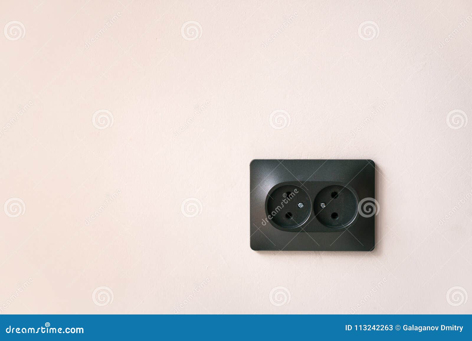 Black Double Electrical Outlet on a Light Pink Wall. Stock Image ...