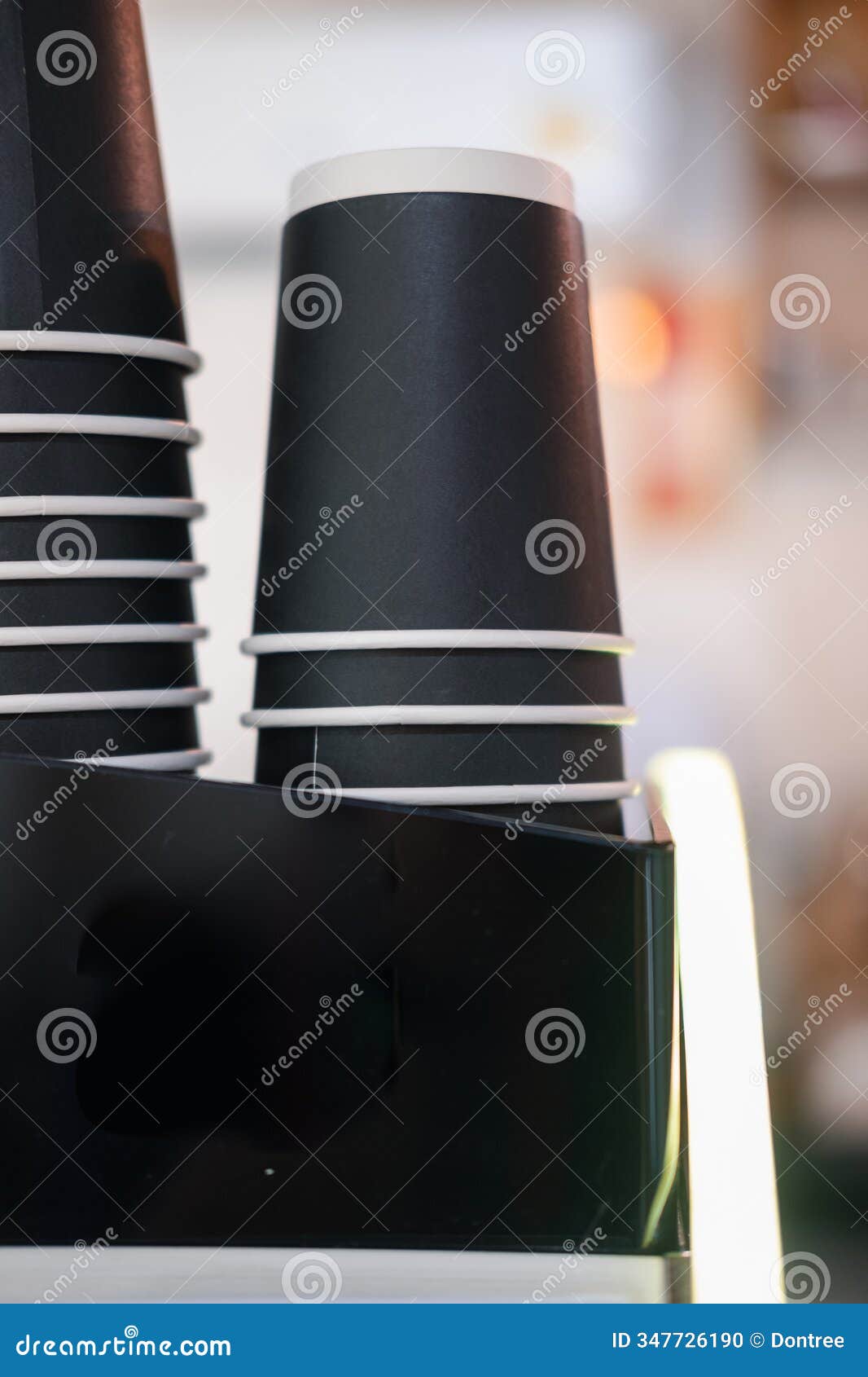 Black Drinking Paper Coffee Cups in Piles on Coffee Machine Stock Photo ...