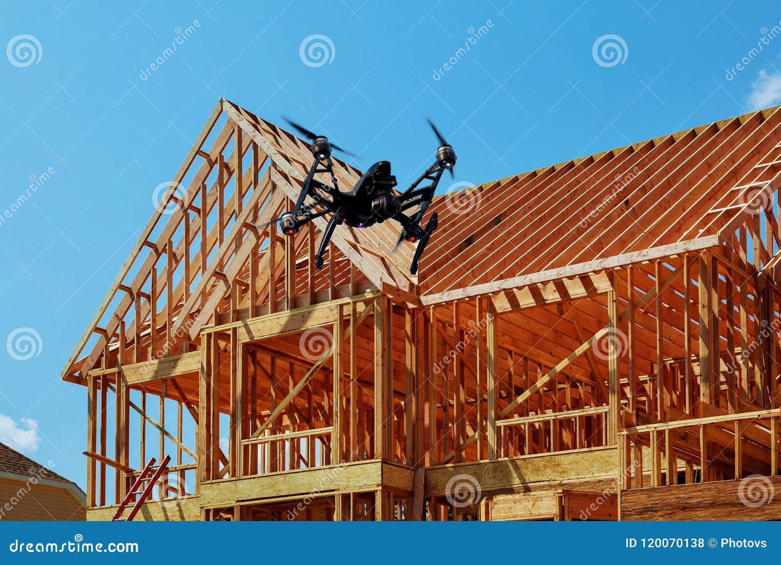 Black Drone Quadcopter with Camera Flying Over Framing of a New House ...
