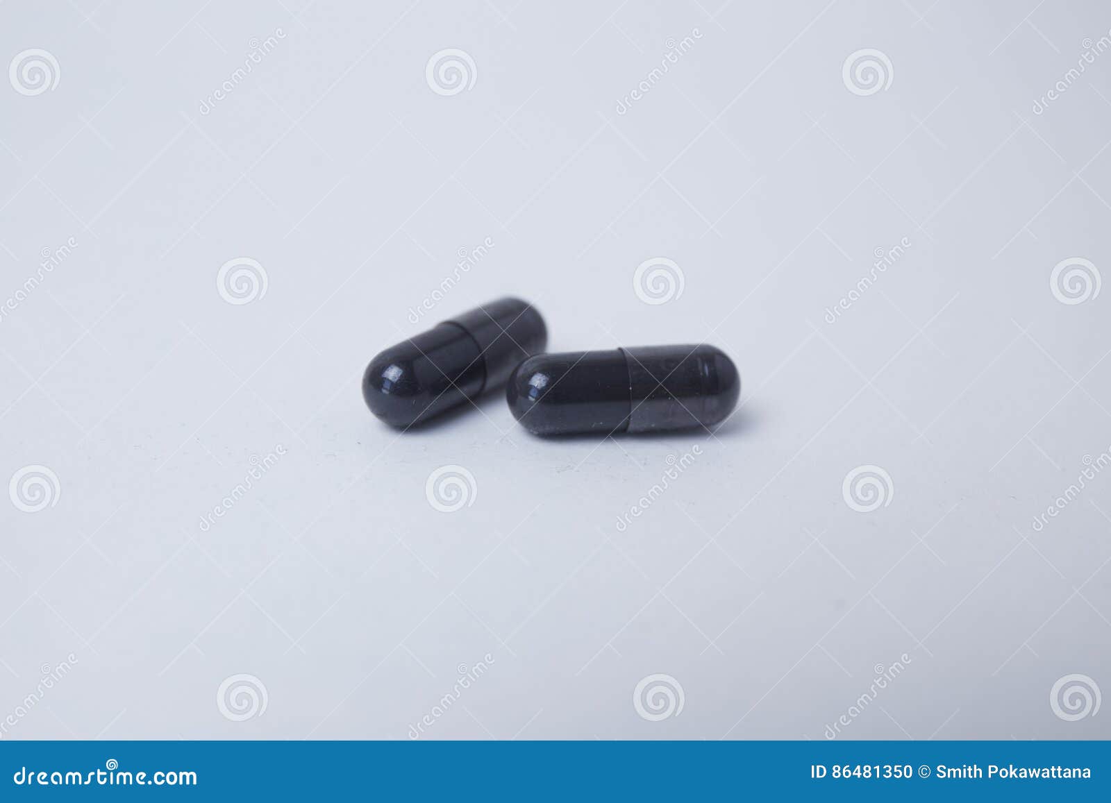 Black drug capsule stock photo. Image of vitamin, relief - 86481350