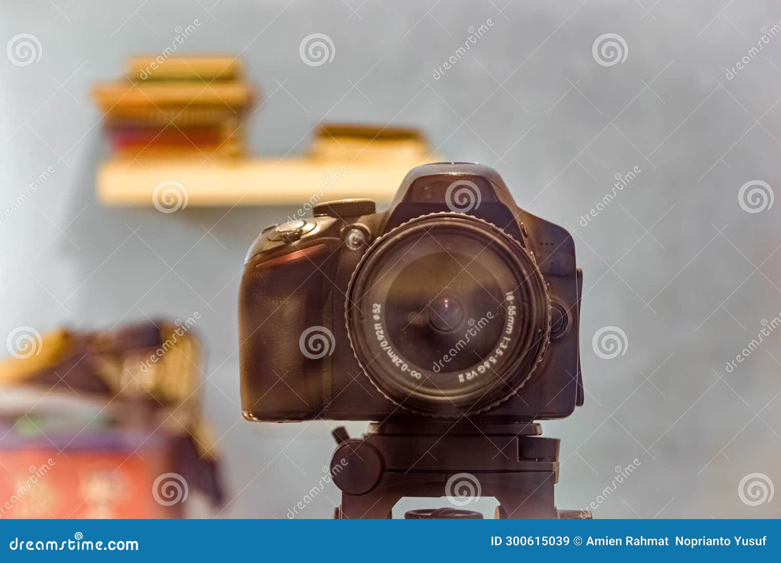 A Black DSLR Camera Mounted on a Tripod Stock Image - Image of hood ...