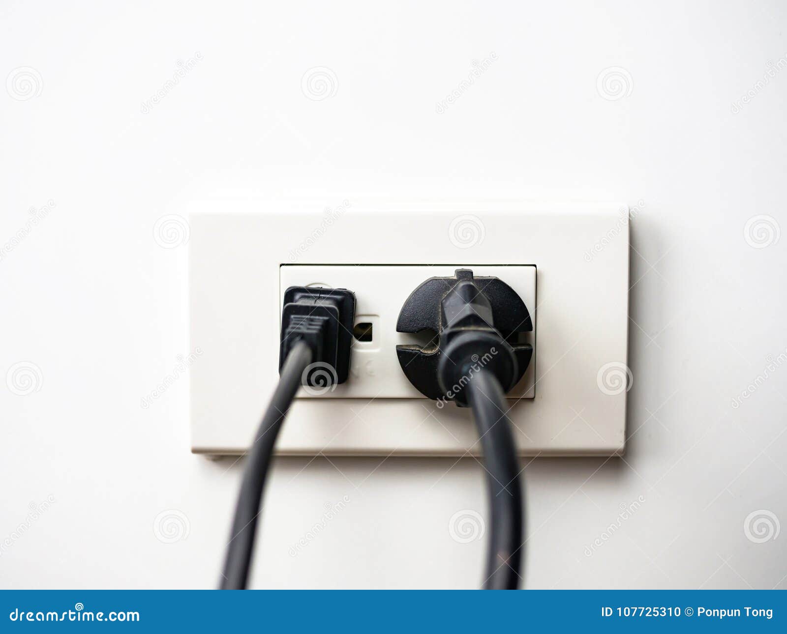 Black Electric Cord Plugged into a Socket Stock Photo - Image of energy ...