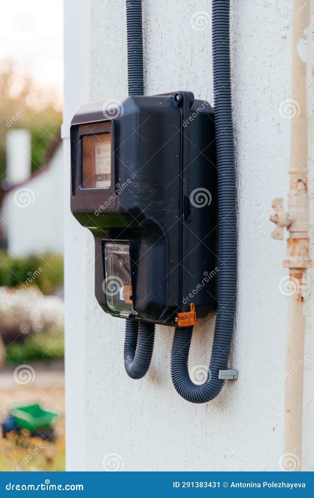 Black Electric Meter on the Wall of the House Stock Image - Image of ...