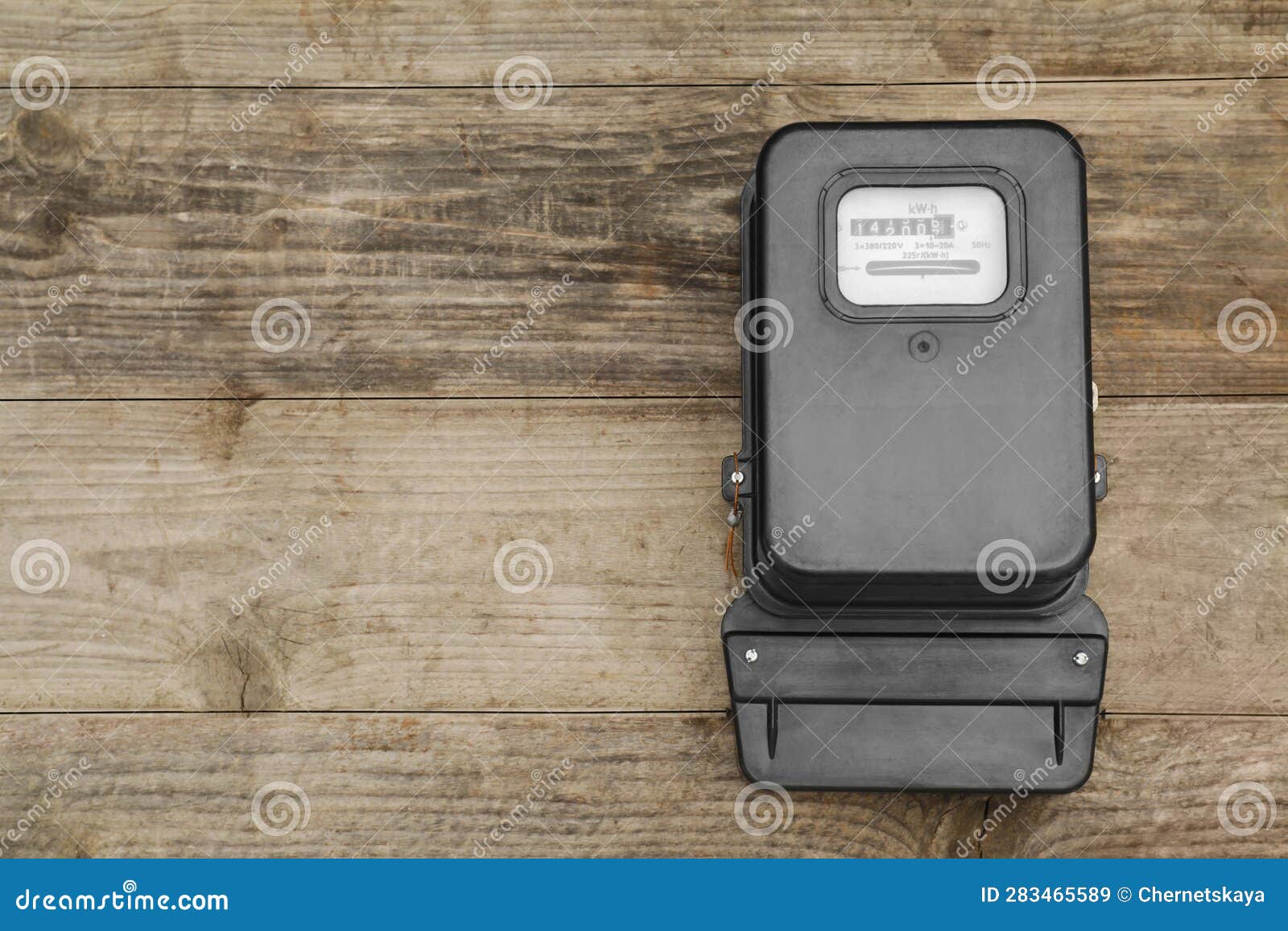 Black Electric Meter on Wood, Top View with Space for Text. Measuring ...