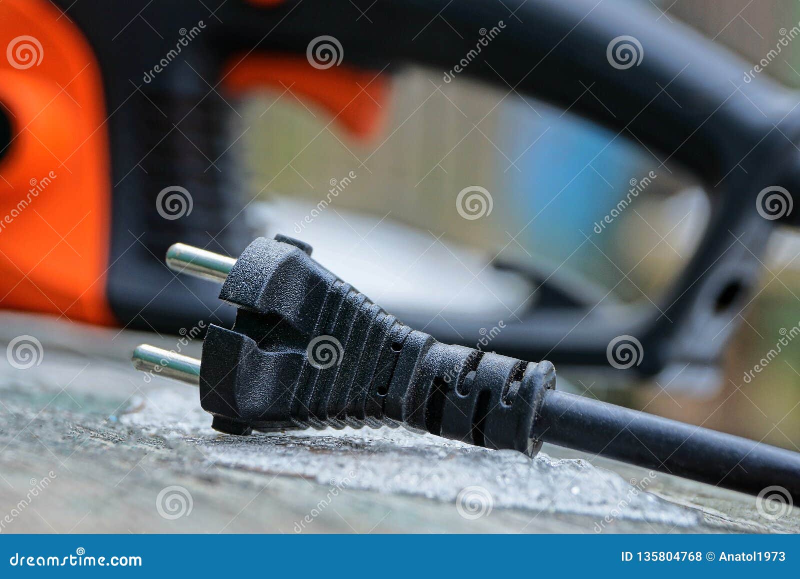 Black Electric Plug on the Cable and Part of the Power Tools on the ...