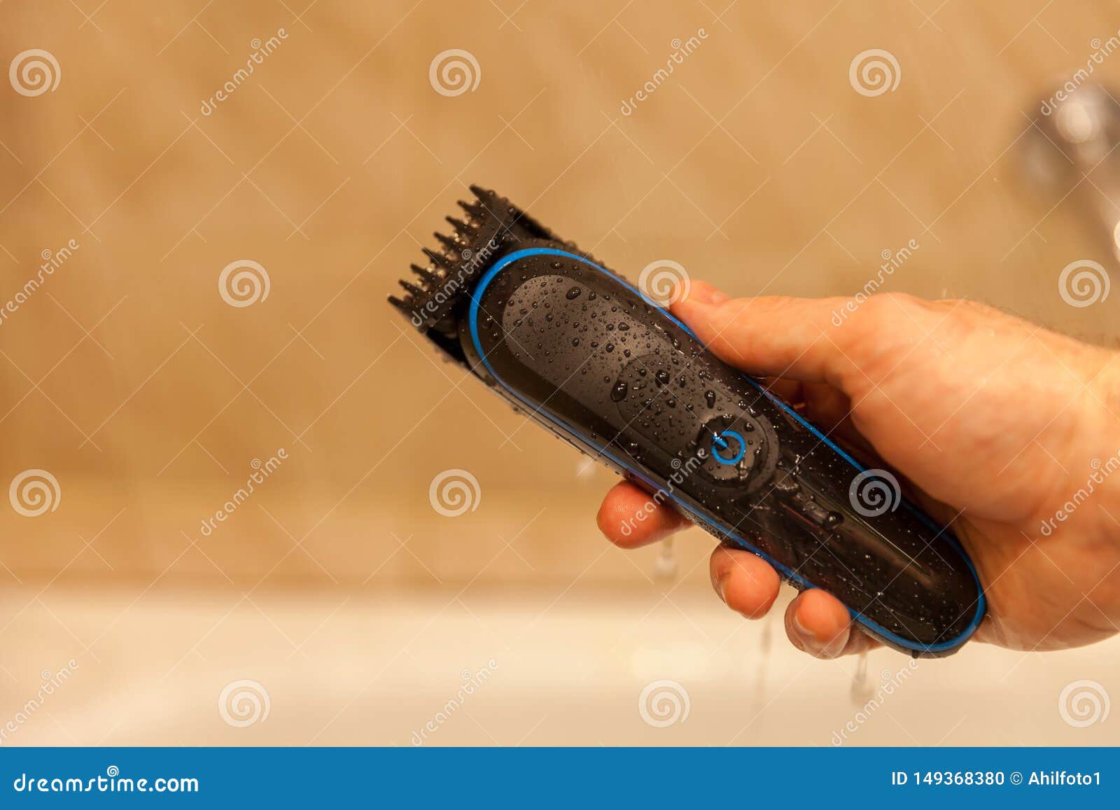 Black Electric Razor in Hand Shower. Stock Photo - Image of equipment ...