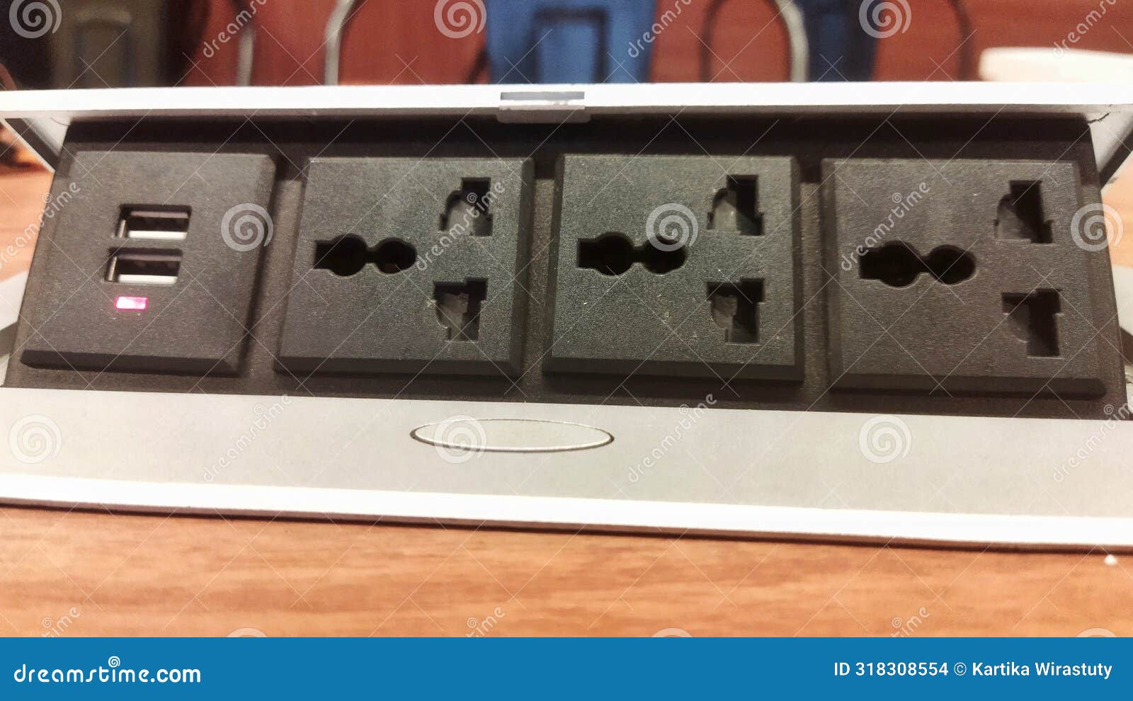Black Electrical Outlet and Network Plug on a Wooden Meeting Table ...