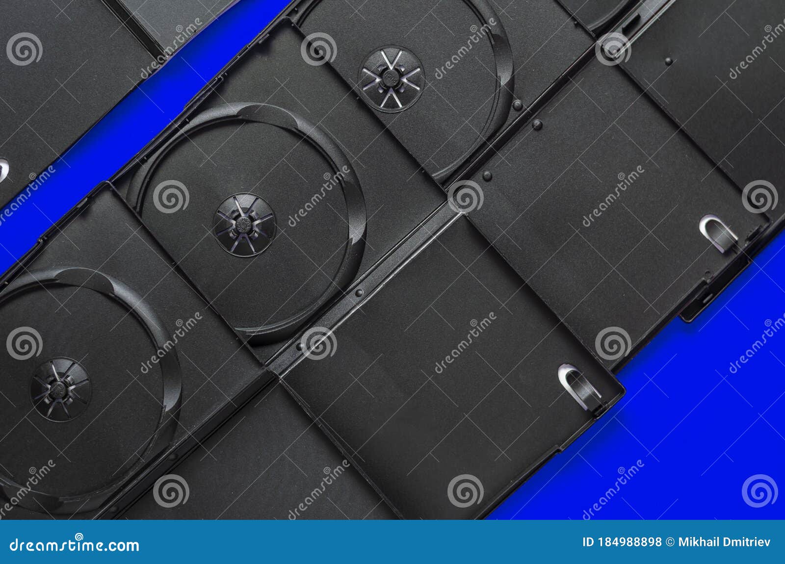 Black Empty Open Boxes for DVD Discs on a Blue Background Stock Photo ...