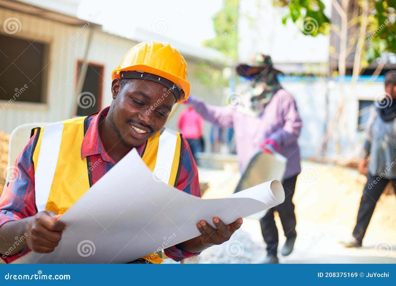 Black Engineer or Contractor Examines the Blueprints Inside the Site ...
