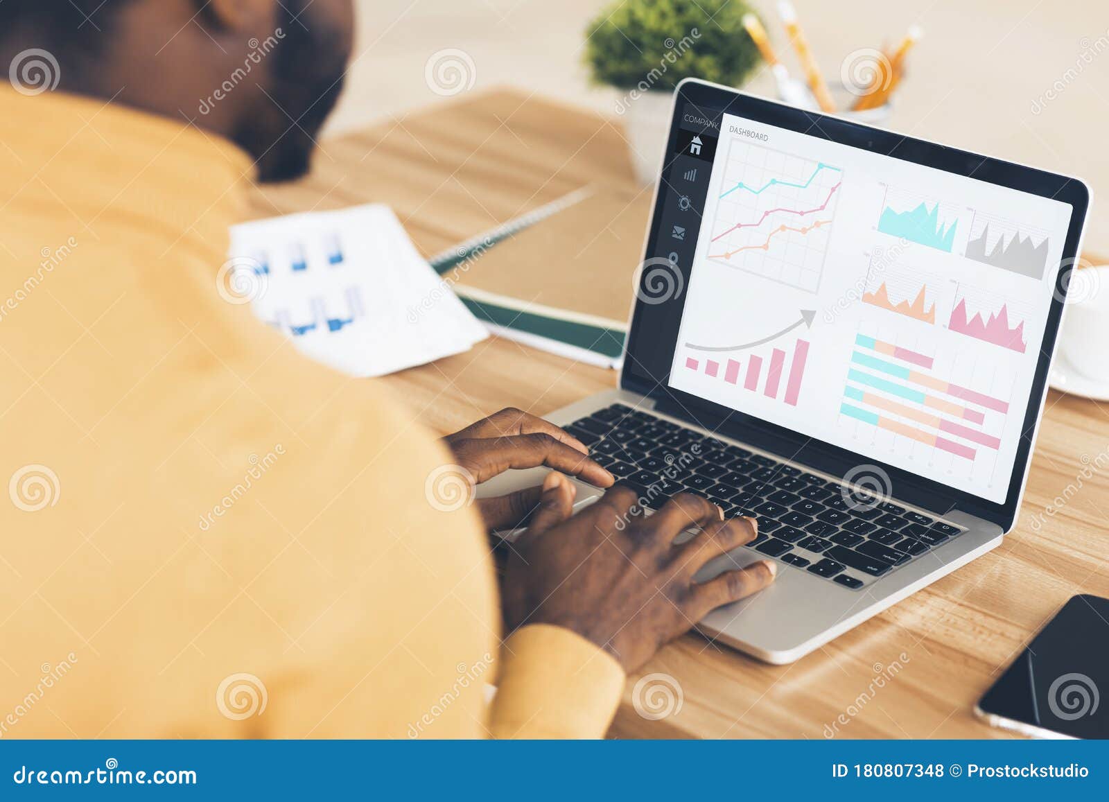 Black Entrepreneur Analyzing Graph on Laptop at Workplace Stock Photo ...