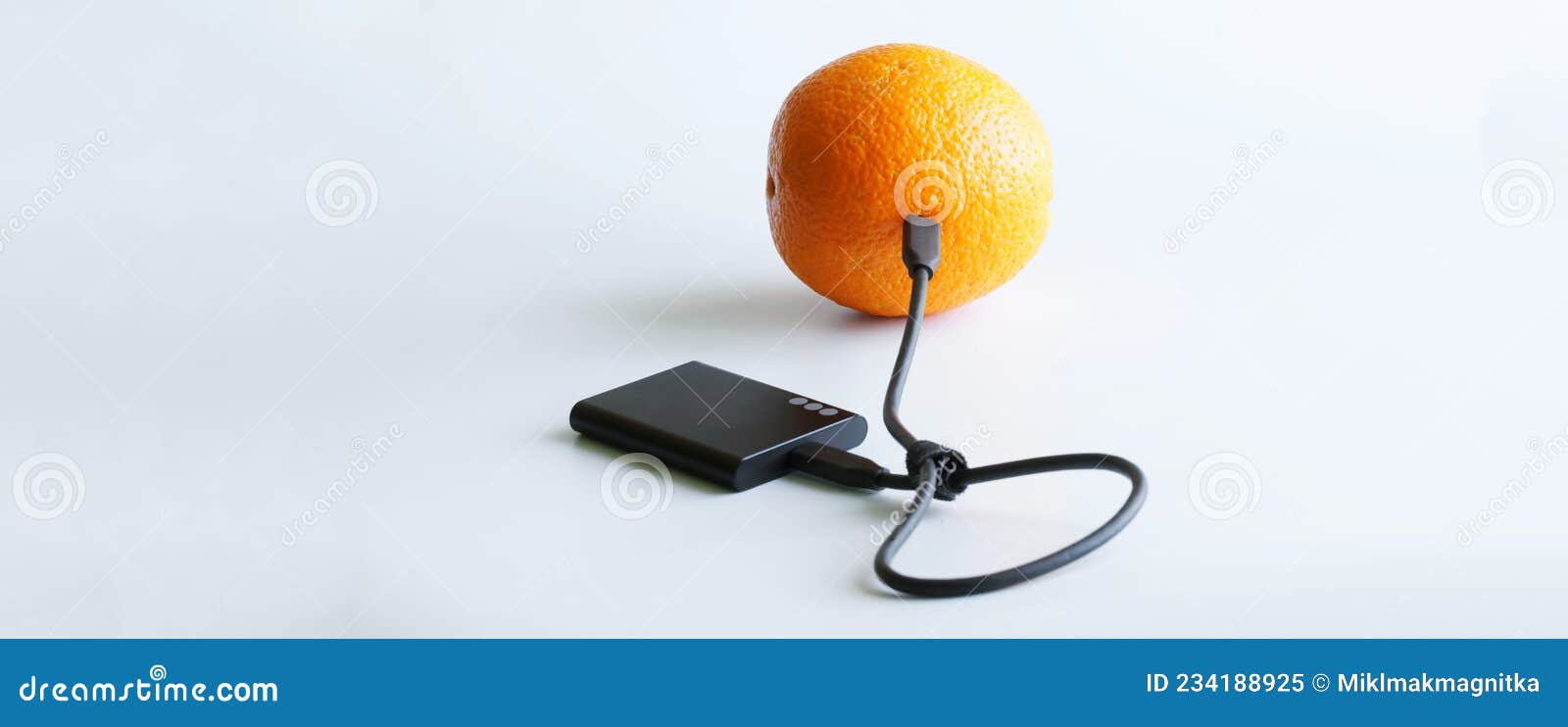 Black External SSD is Wired To a Fresh Orange. Concept of Green ...