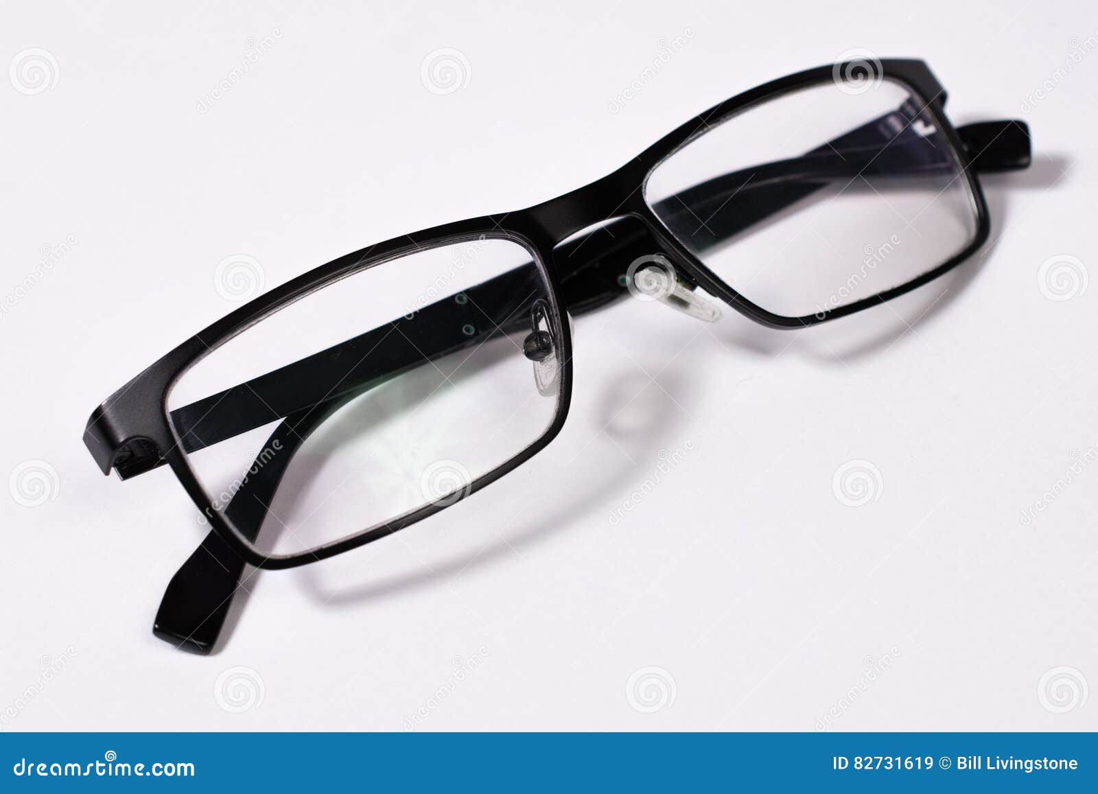 Black Eye Glasses Folded on White Stock Image - Image of white, lens ...