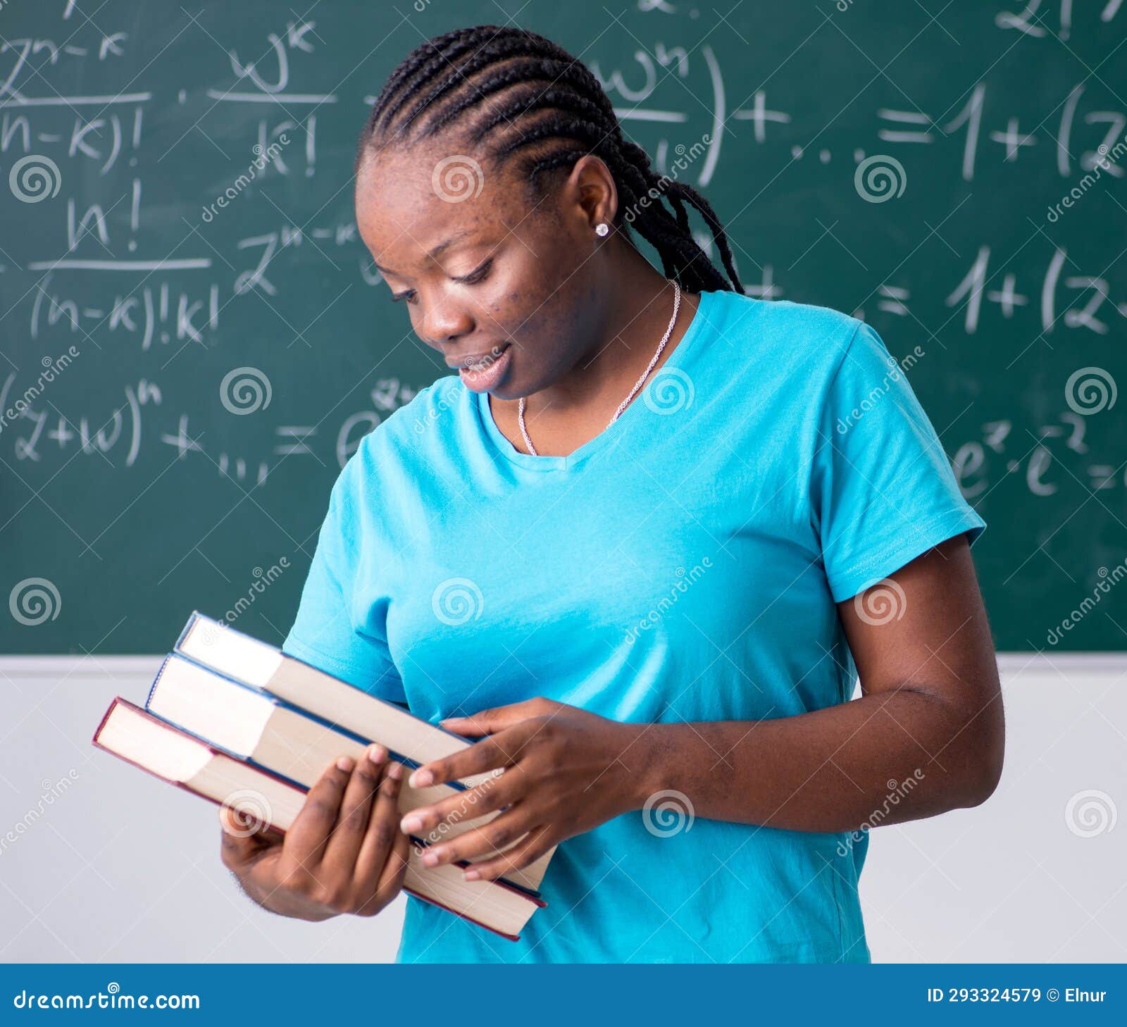 Black Female Student in Front of Chalkboard Stock Image - Image of ...