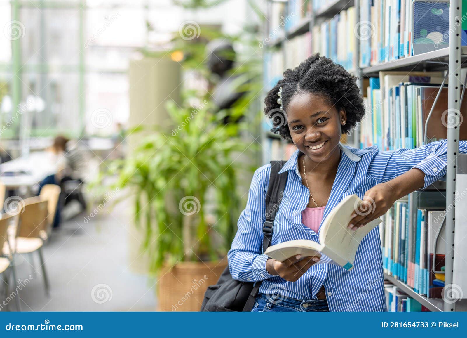 Black Female Student Reading a Book in a Library Stock Image - Image of ...