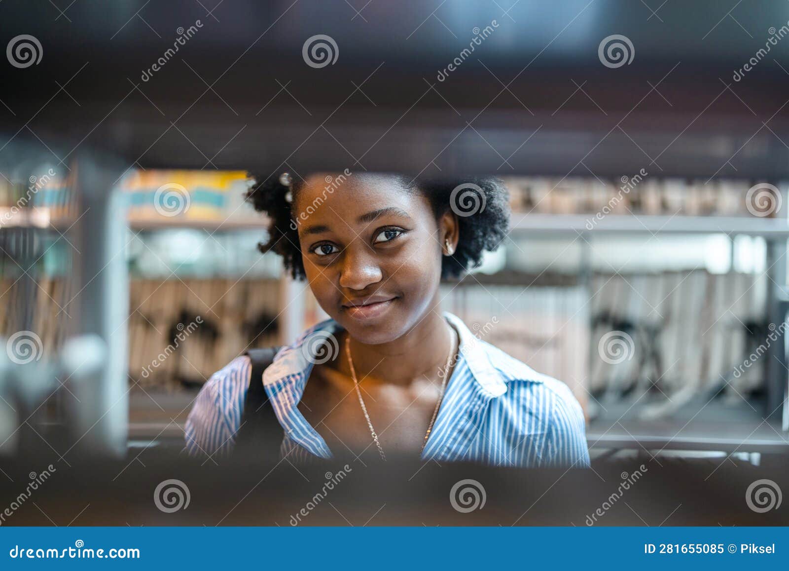 Black Female Student Standing in a Library Stock Image - Image of books ...