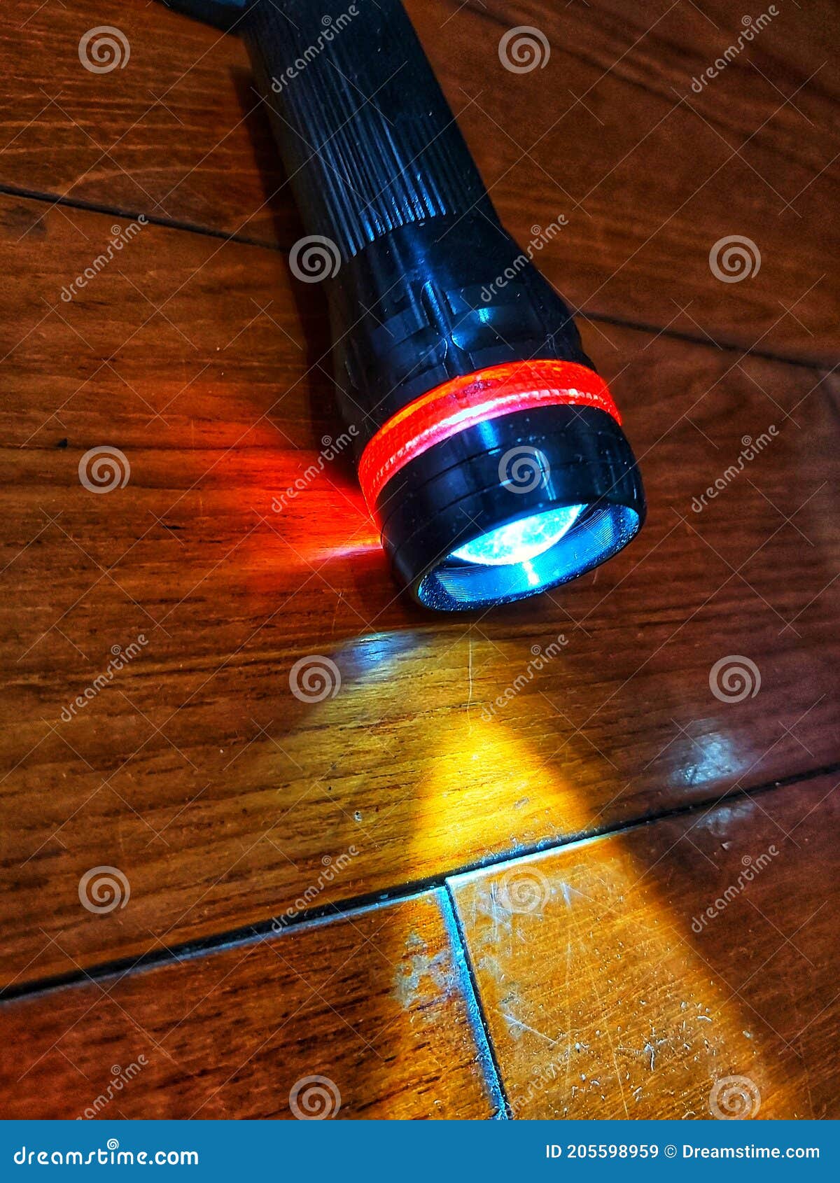 A Black Flashlight Lying Brightly Lit. Stock Image - Image of ...