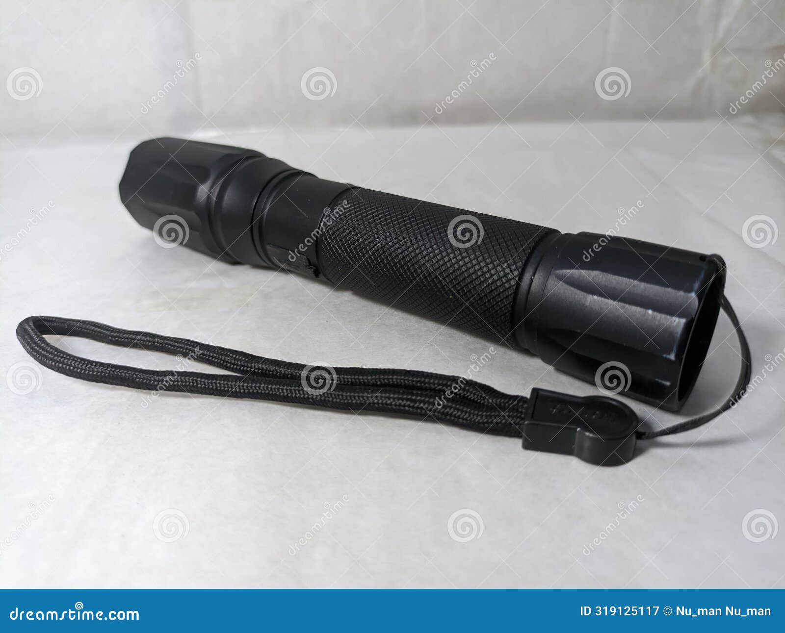 Black Flashlight. Flashlight is on White Surface Stock Image - Image of ...