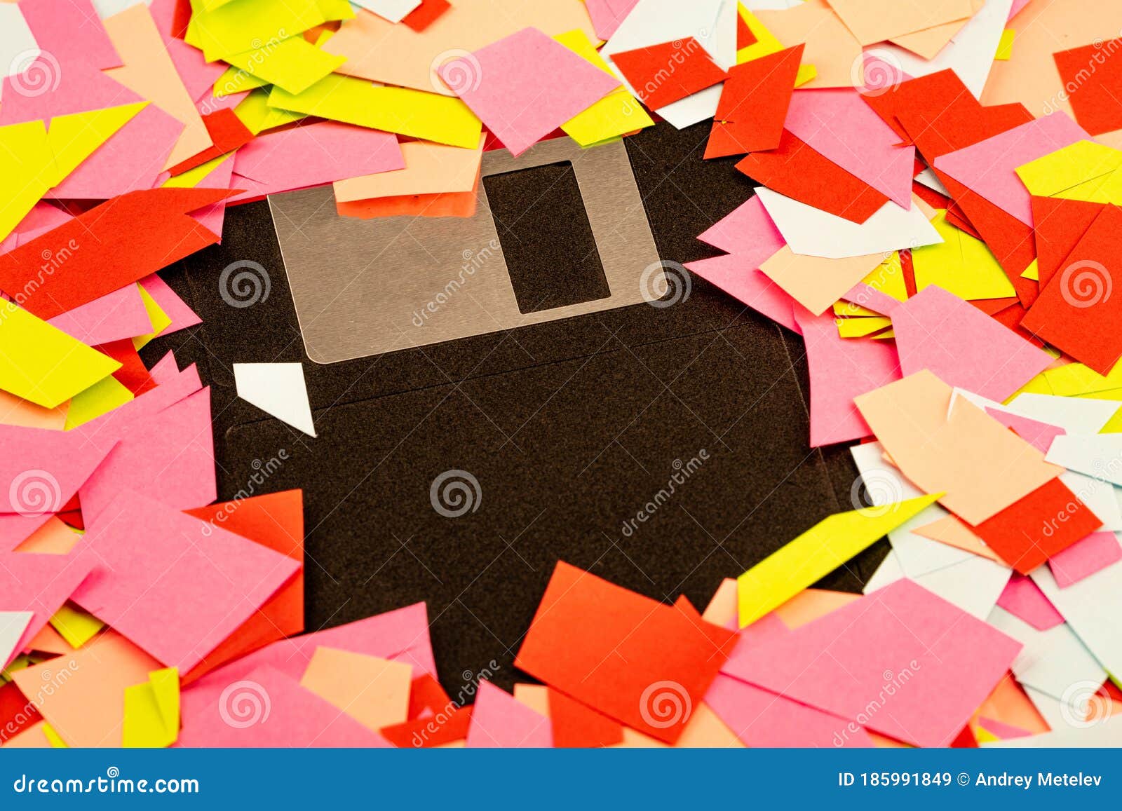 Black Floppy Disk in Multi-colored Pieces of Paper Stock Image - Image ...