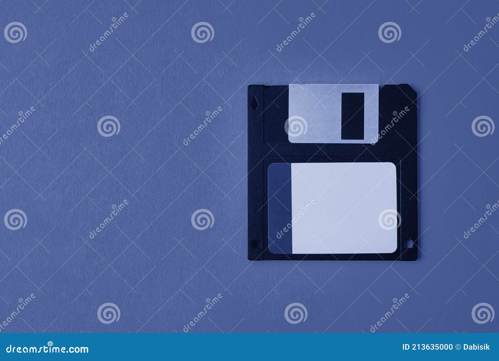 Black Floppy Diskette on Blue Background. Vintage Computer Diskette ...
