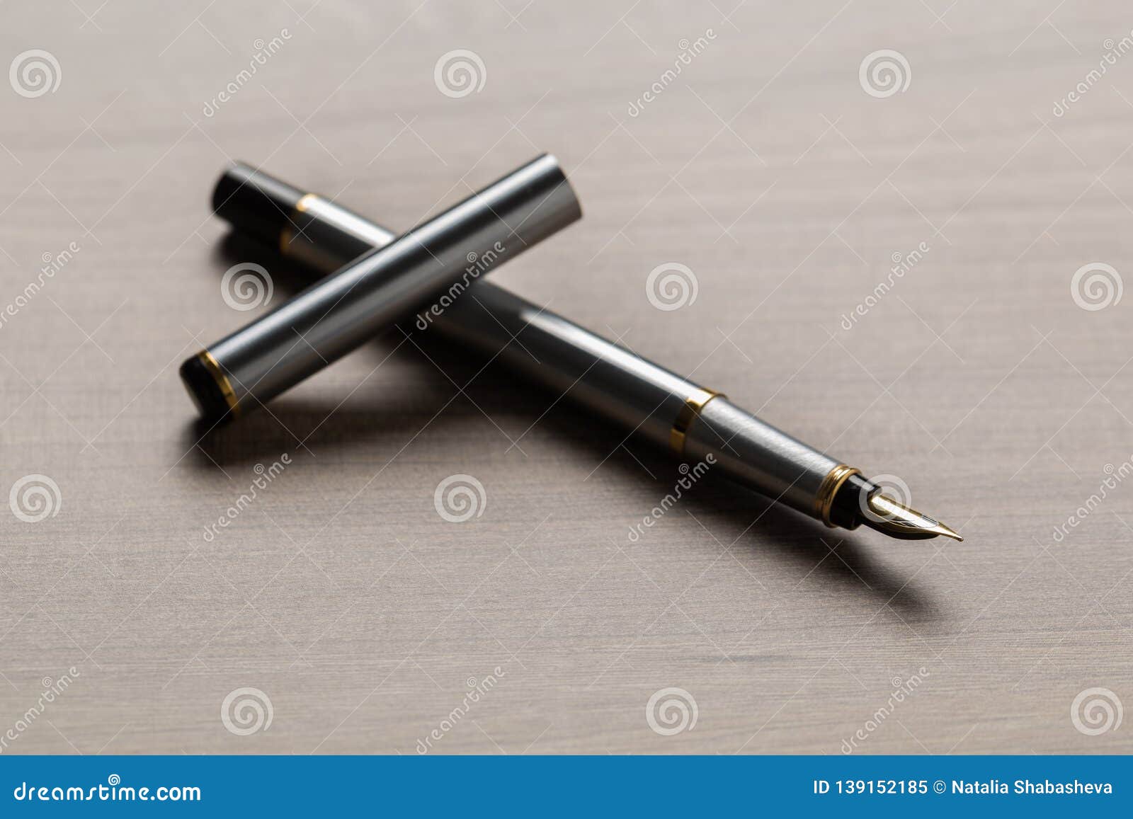 Black Fountain Pen on Table Stock Image - Image of table, blue: 139152185