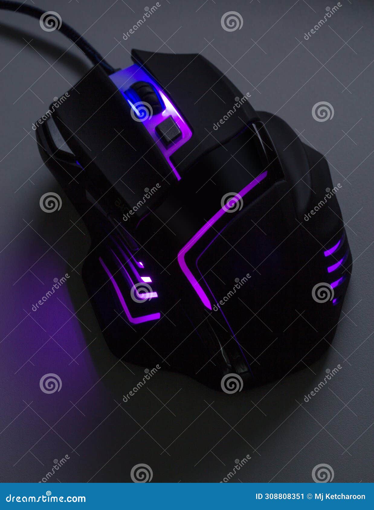 A Black Gaming Mouse with a Purple Light Stock Image - Image of ...