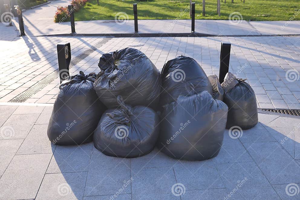 Black Garbage Bags Stack on a Park Stock Image - Image of pile ...