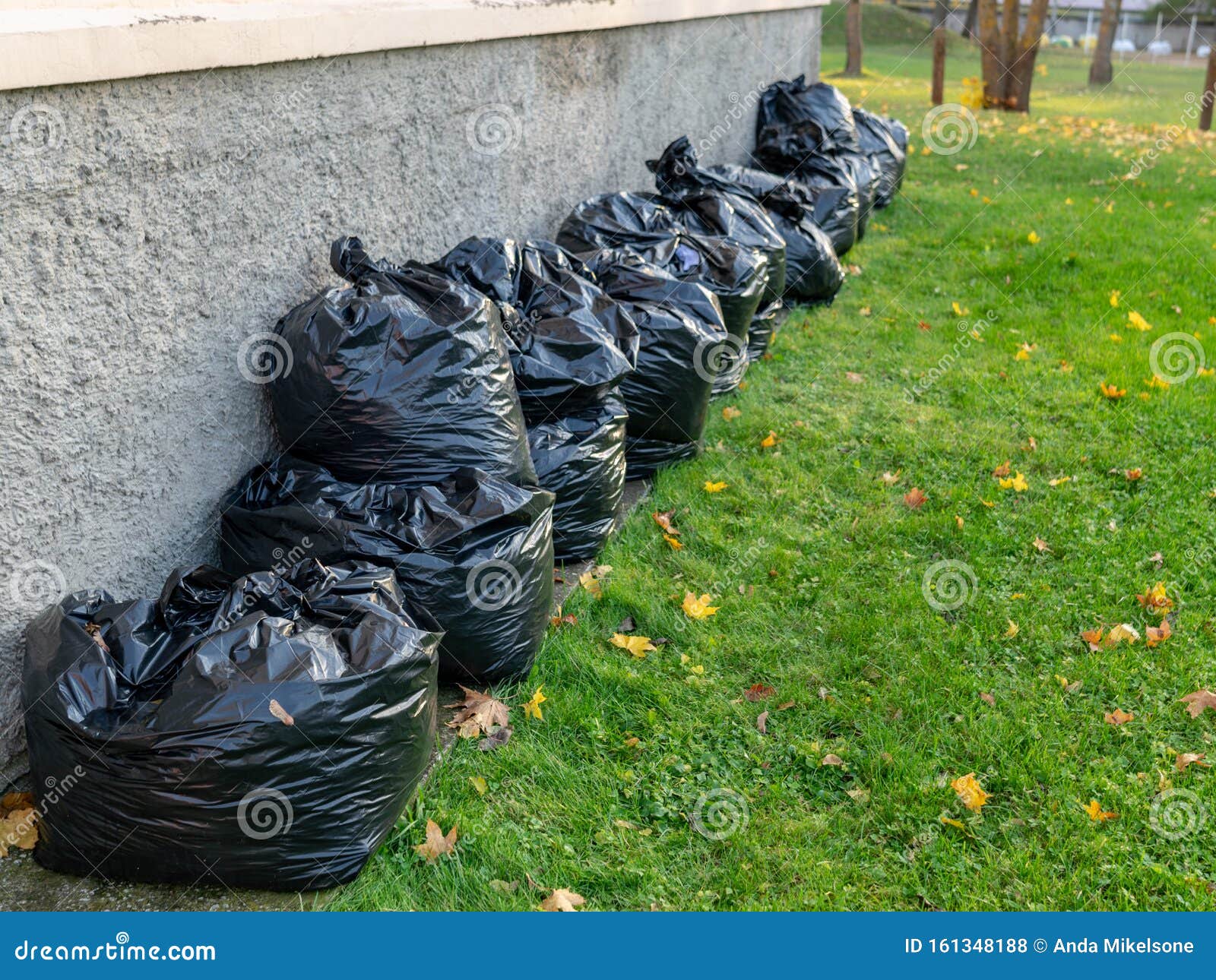 Black Garbage Bags on the Wall of the House Stock Photo - Image of ...