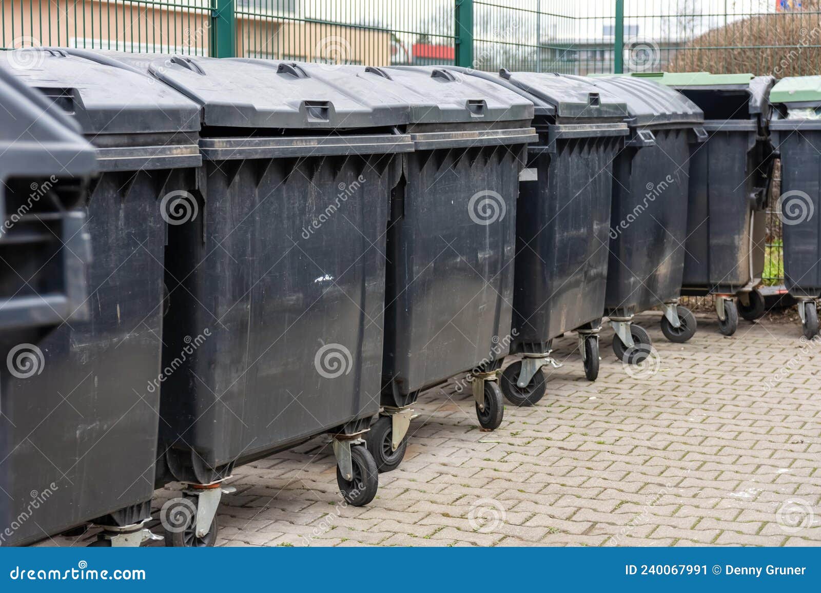 Black Garbage Cans in a City Stock Image - Image of paving, household ...