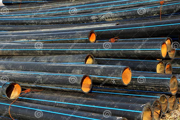 Black gas pipe on a pile stock image. Image of circle - 20266159