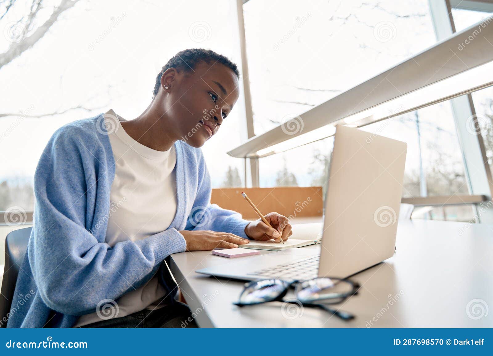 Black Girl Student Using Laptop Learning Online Sitting at Desk in ...