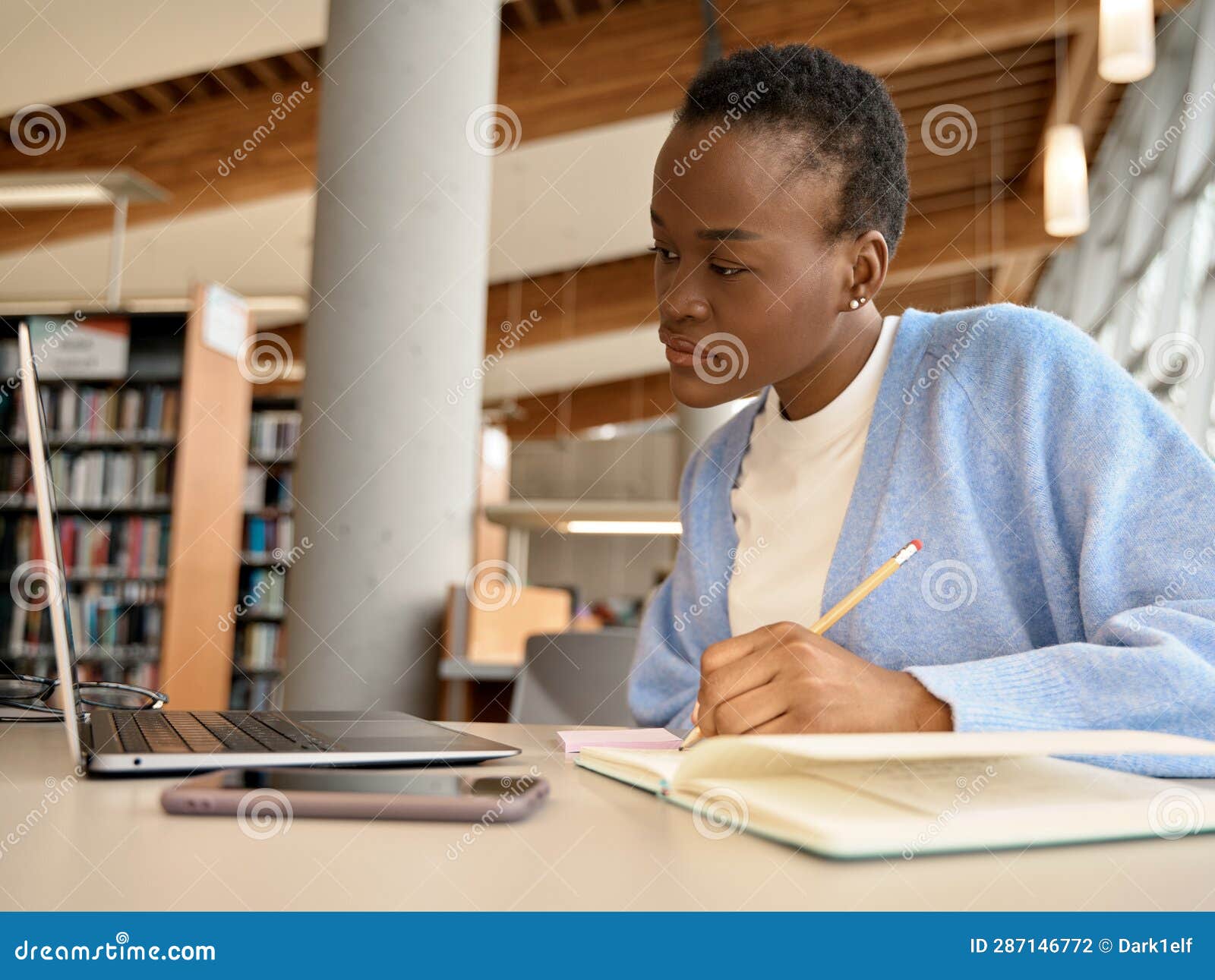 Black Girl Student Using Laptop Learning Online Sitting at Desk in ...
