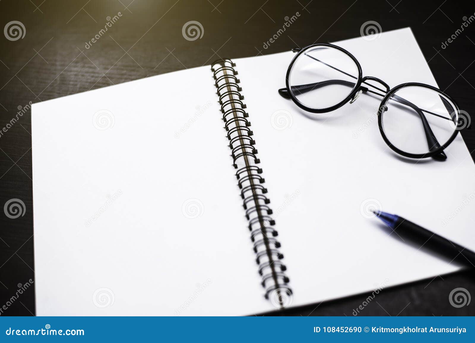 Glass on the Open Book on the Work Desk Stock Photo - Image of camera ...