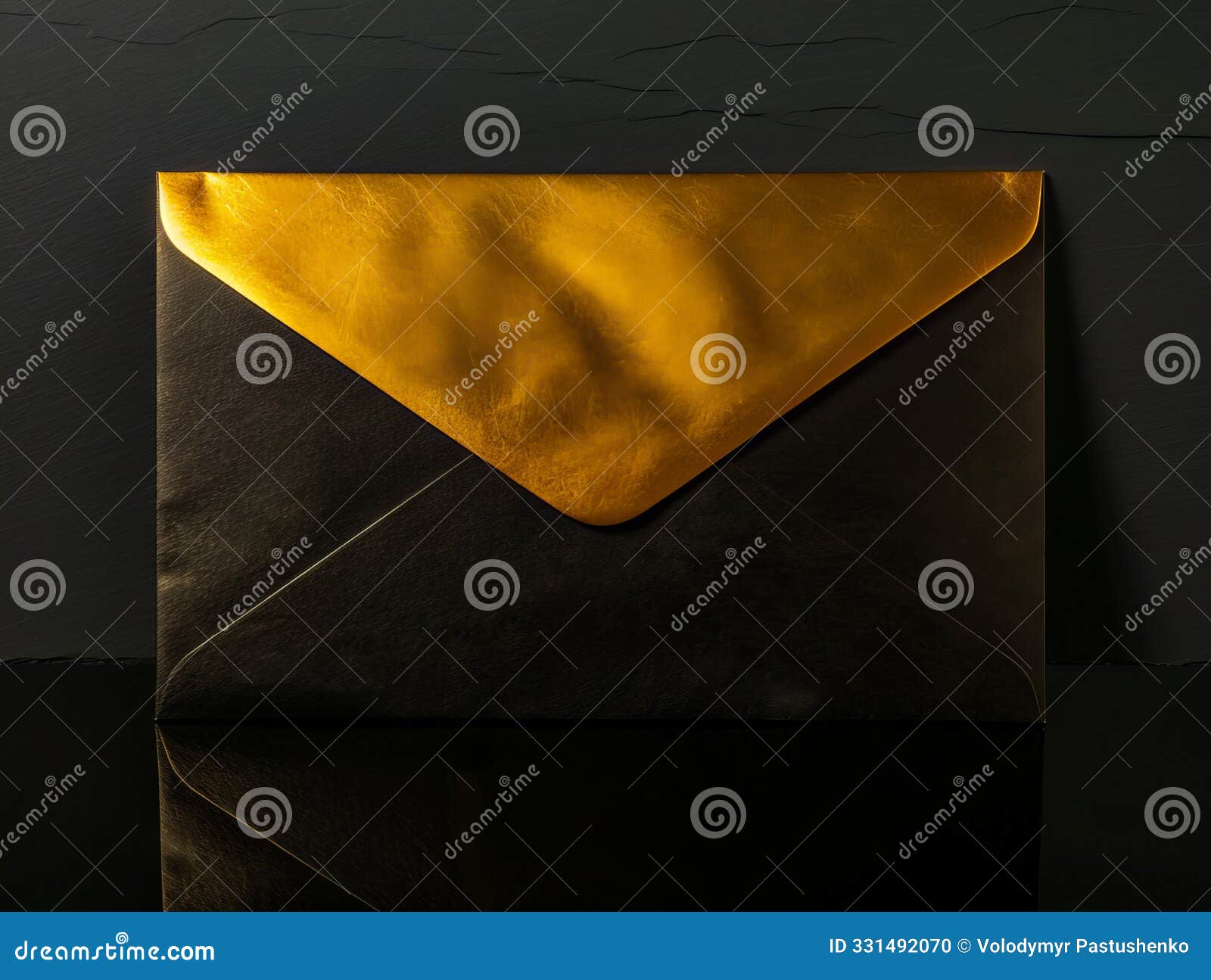 A Black and Gold Envelope on a Black Surface Stock Photo - Image of ...