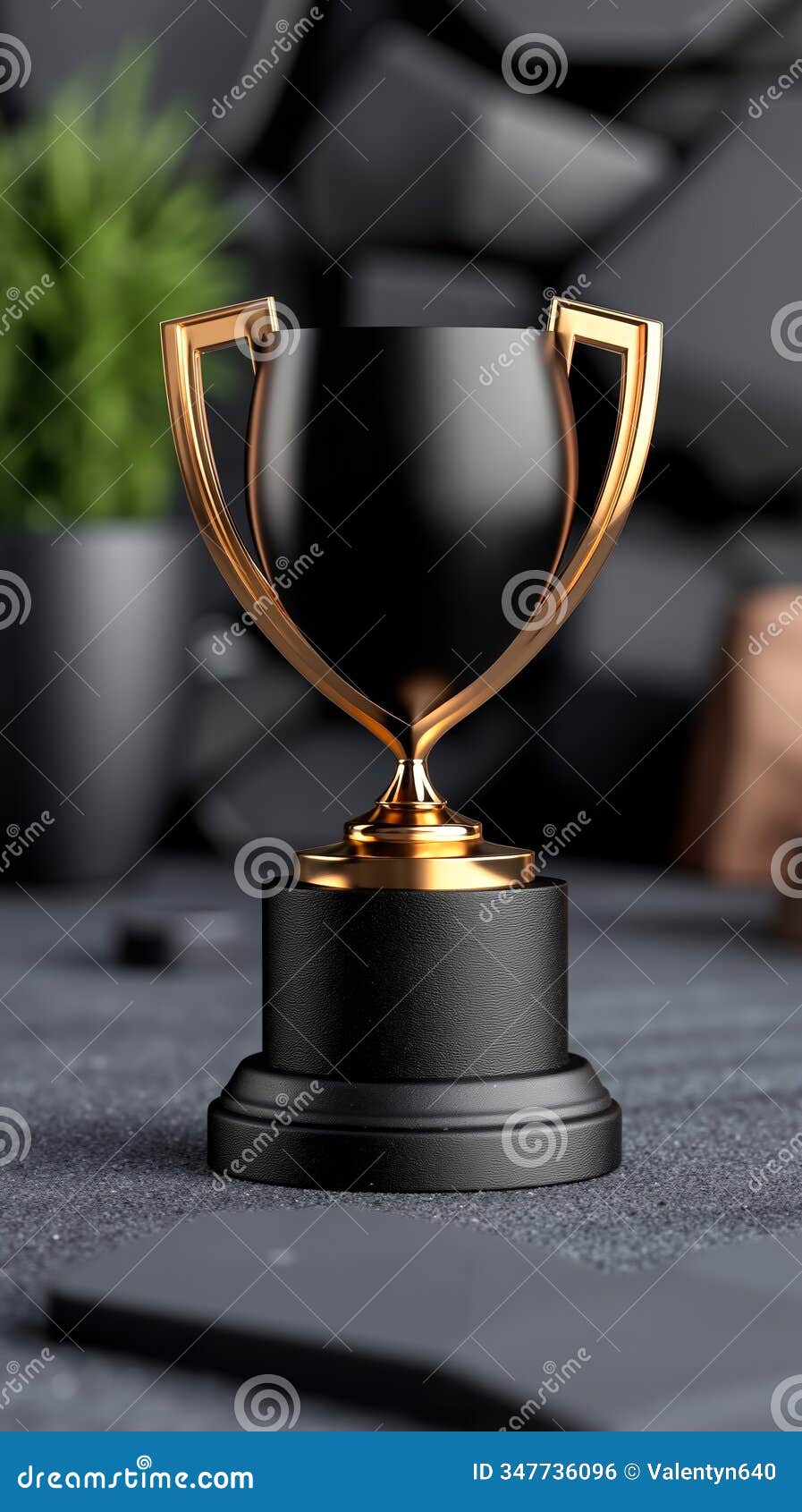 A Black and Gold Trophy Sitting on Top of a Table Stock Photo - Image ...