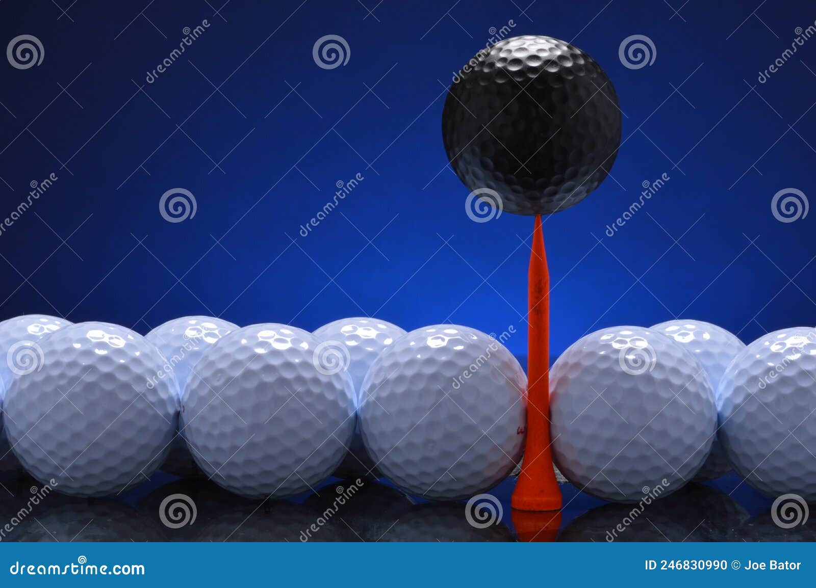 Black Golf Ball Balancing on Inverted Tee Stock Photo - Image of ...