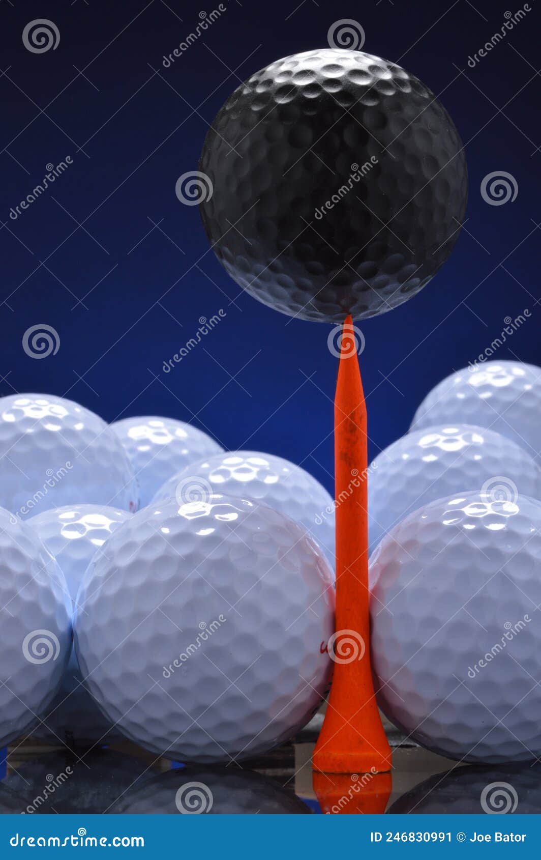 Black Golf Ball Balancing on Inverted Tee Stock Image - Image of sports ...