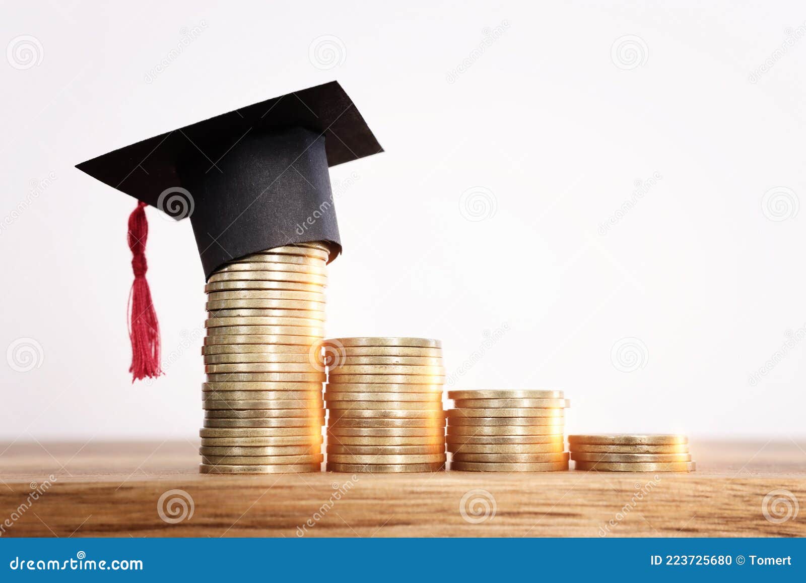 Black Graduation Cap Over Stack of Coins Stock Photo - Image of money ...
