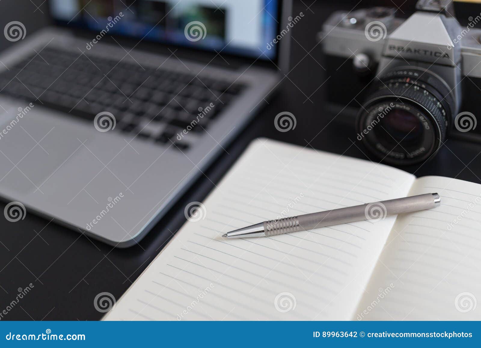 Black And Gray Dslr Camera Beside Macbook Pro Picture. Image: 89963642