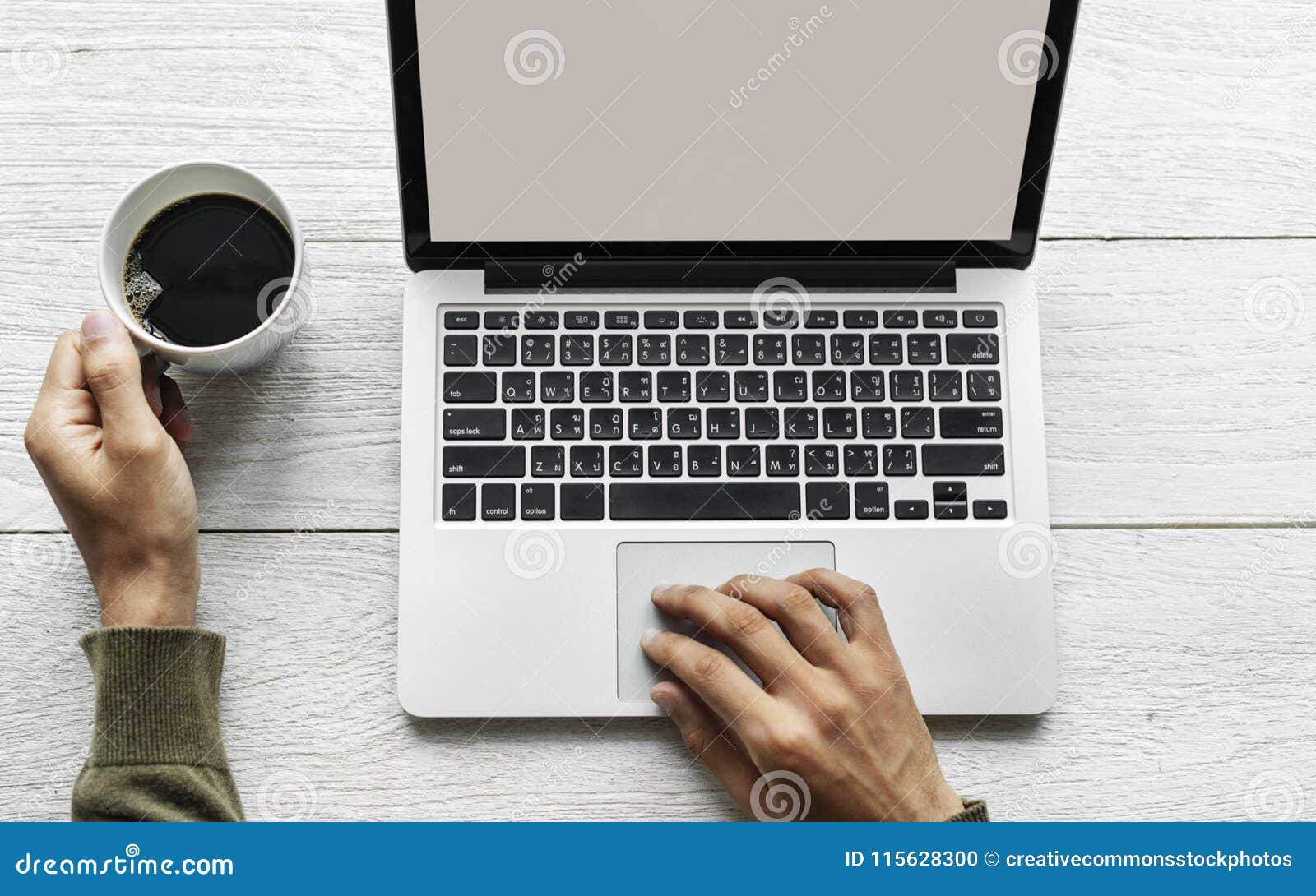 Black And Gray Laptop Computer On Brown Wooden Surface Picture. Image ...