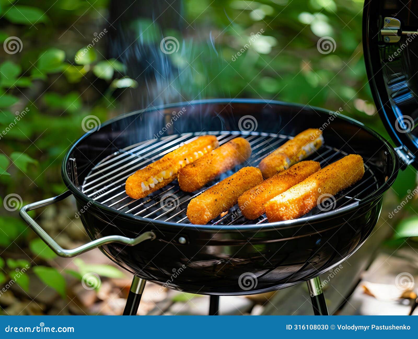 A Black Grill with Some Fish Sticks on it Stock Photo - Image of ...